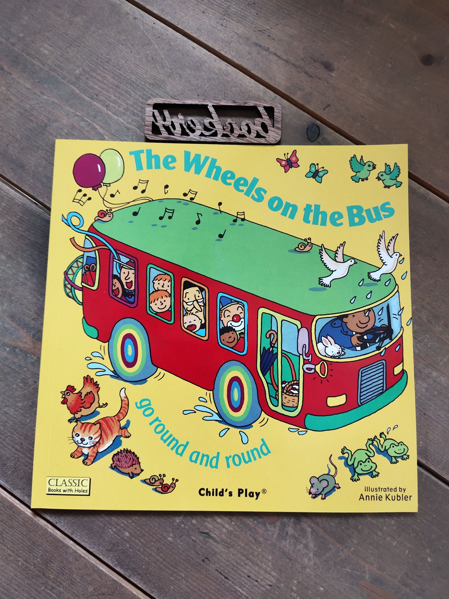 Wheels On The Bus Go Round And Round Classic Book With Holes The
